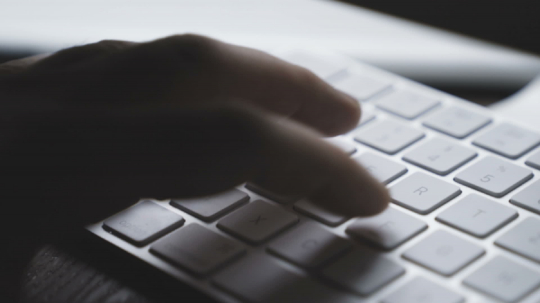 very close Close-up hands typing password on keyboard in office ...